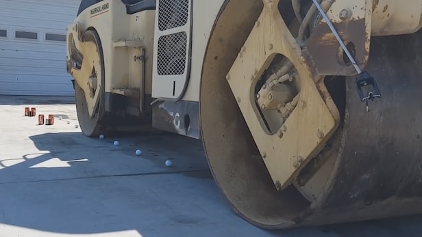This video of a steamroller unable to crush a golf ball is oddly ...