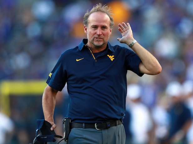 West Virginia head coach Dana Holgorsen puts the Rutgers football ...