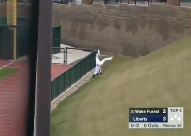 Liberty outfielder makes diving-over-the-fence catch for first official ...